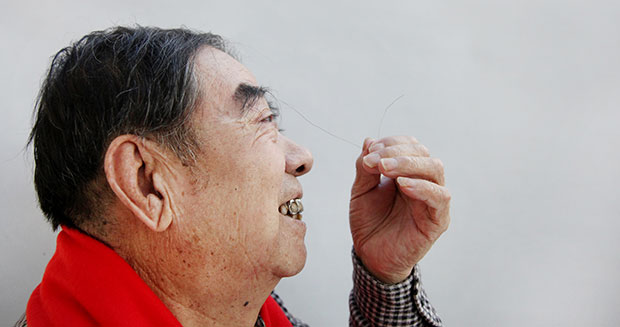 Eighty-one year old Chinese man has longest eyebrow hair in the world | Guinness World Records
