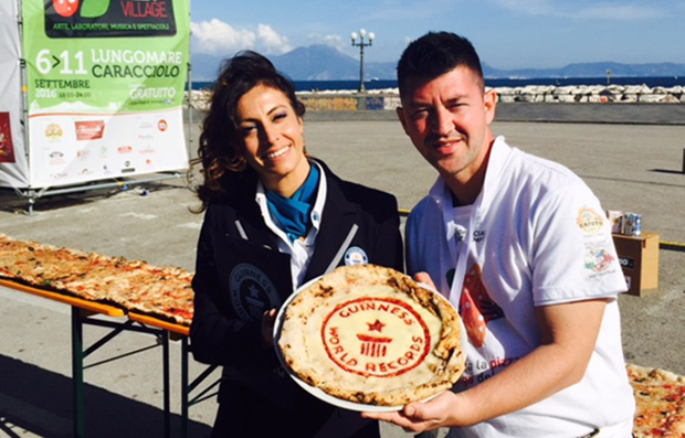 Italian chefs create mile-long Neapolitan to break longest pizza record ...