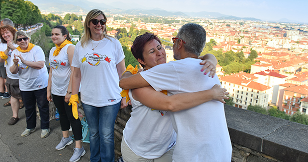 Citizens of Bergamo in Italy achieve longest hug relay around ancient ...