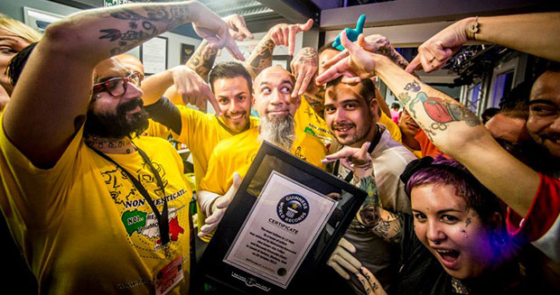 Italian tattoo artist reclaims record for 57 hour inking marathon ...