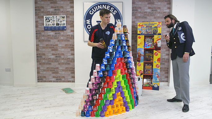 Watch this sport stacker set a lightning-fast cup pyramid record ...