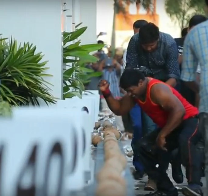 Indian man smashes his way to new record by breaking open coconuts with ...