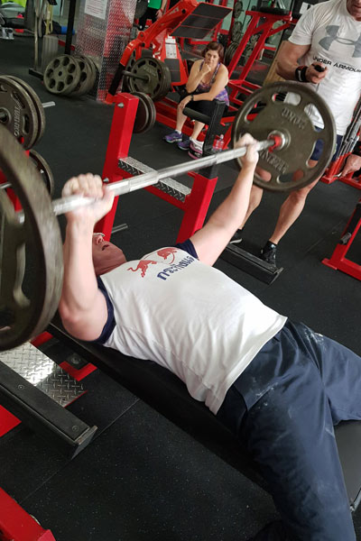 Video: Powerlifting champion beats challenging bench press record by ...