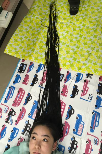 Woman who held longest hair record has her first ever haircut ...