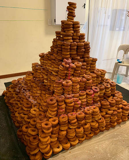 Sweet taste of success as more than 3,000 doughnuts are stacked to form ...