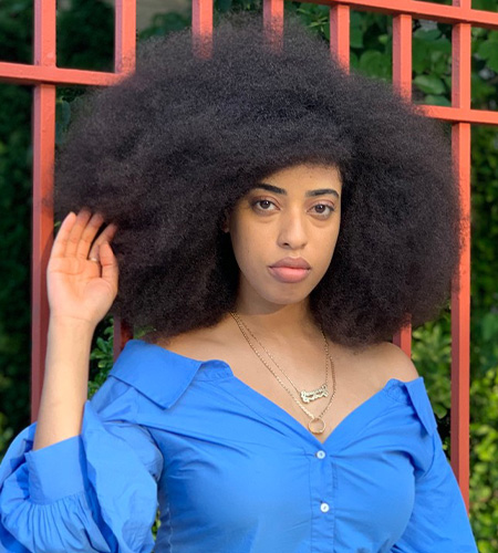 American woman breaks record for largest afro | Guinness World Records