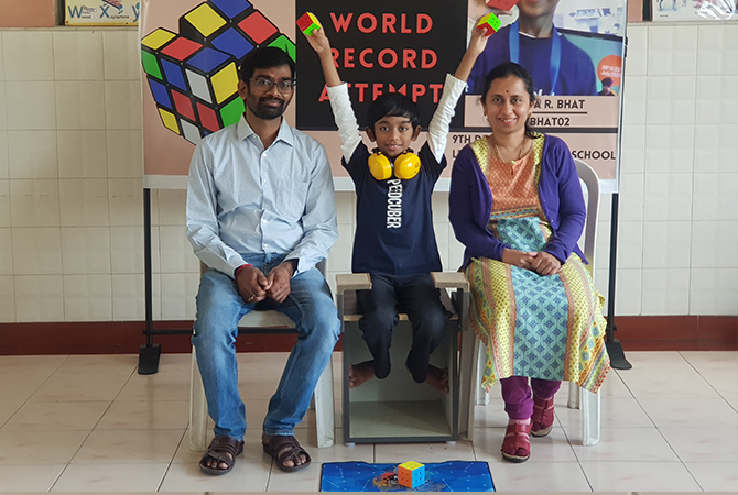 Triple cube triumph: Eight-year-old speedcuber breaks hands and feet ...