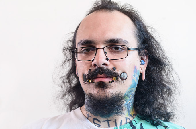 "Your body, your decision": James Goss on his 14 facial flesh tunnels ...