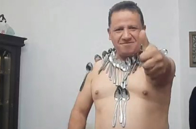 Iranian man balances 85 spoons on his body breaking record | Guinness ...