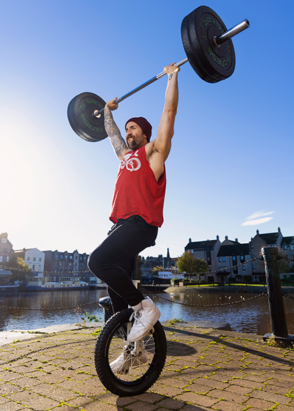 Scottish unicyclist breaks epic powerlifting record | Guinness World ...