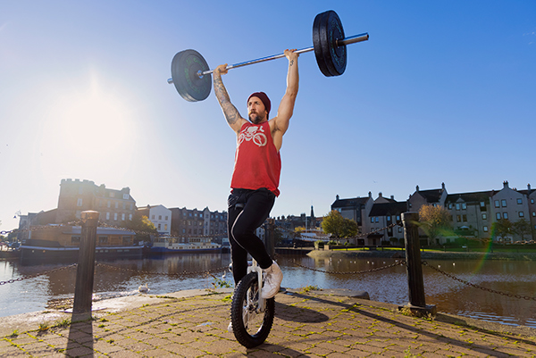 Scottish unicyclist breaks epic powerlifting record | Guinness World ...