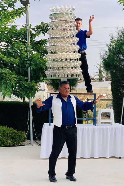 Cypriot man shatters record with 319 wine glasses balanced on head ...