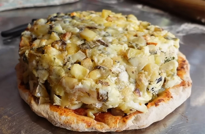French chefs make pizza with 1,001 types of cheese to break record | Guinness World Records