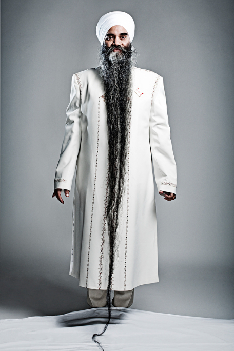 Man with the world's longest beard grows famous facial hair even longer ...