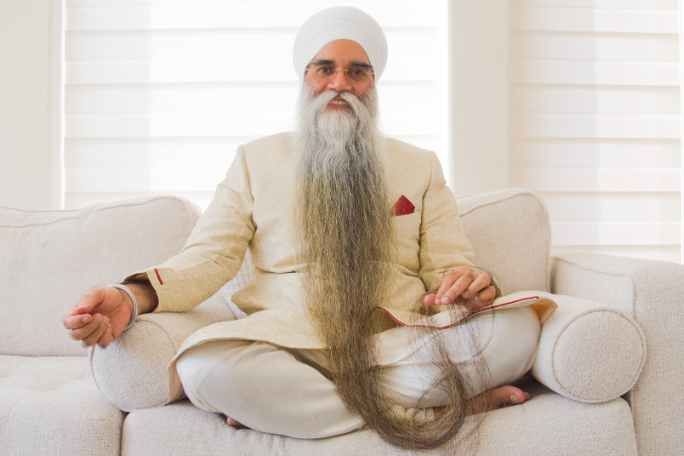 Man with the world's longest beard grows famous facial hair even longer ...