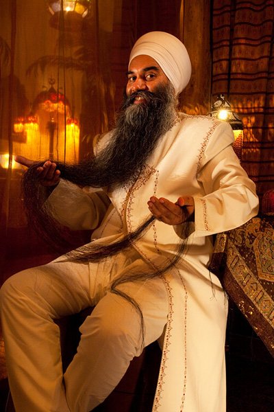 Man with the world's longest beard grows famous facial hair even longer ...