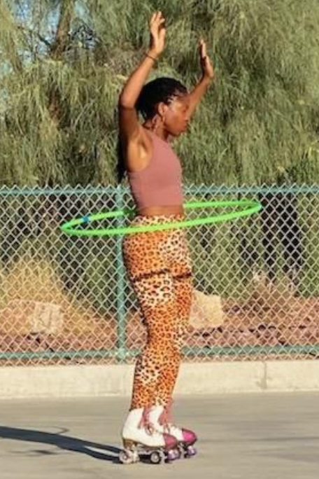 Watch this skating superstar roller skate and hula hoop backwards ...