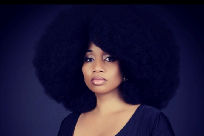 Woman with world's largest afro says pride in her hair has led to self ...