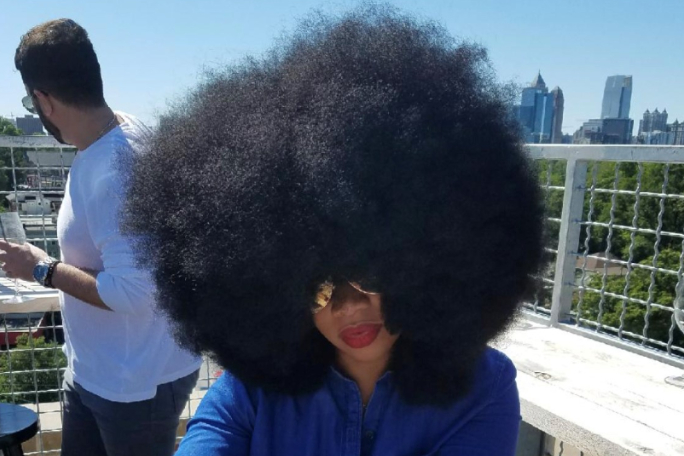 Woman with world's largest afro says pride in her hair has led to self ...