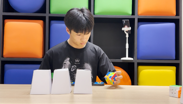 Teenage brothers team up to snatch four impressive puzzle cube records ...