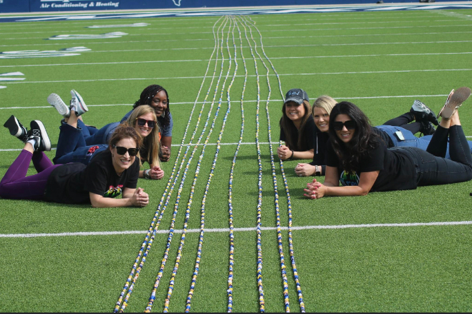 Students and teachers celebrate togetherness by weaving longest ...