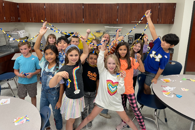 Students and teachers celebrate togetherness by weaving longest ...