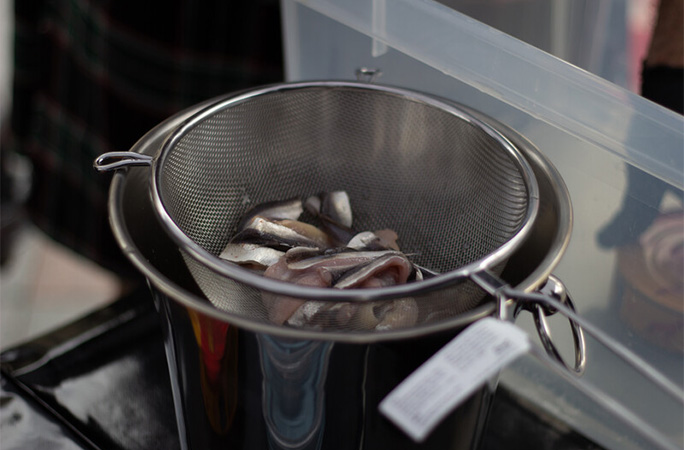 Man eats record amount of fermented fish that's so smelly it makes ...