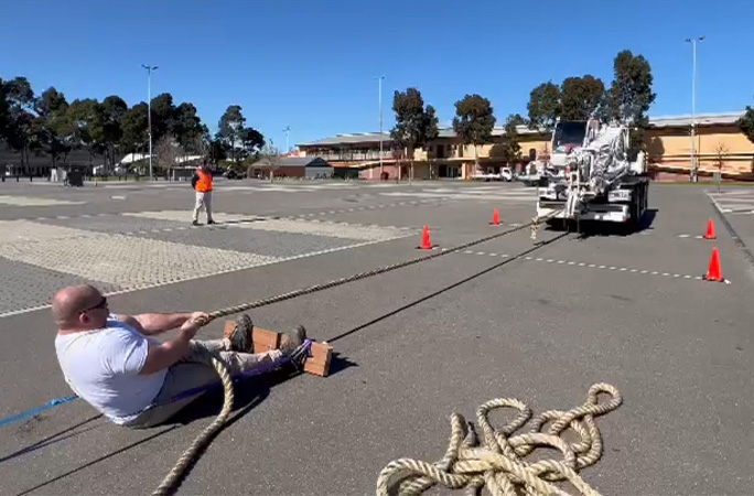 Australian strongman pulls 20,000-kg crane while sitting down ...
