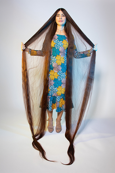 Real-life Rapunzel claims longest hair record with stunning 8-ft locks ...