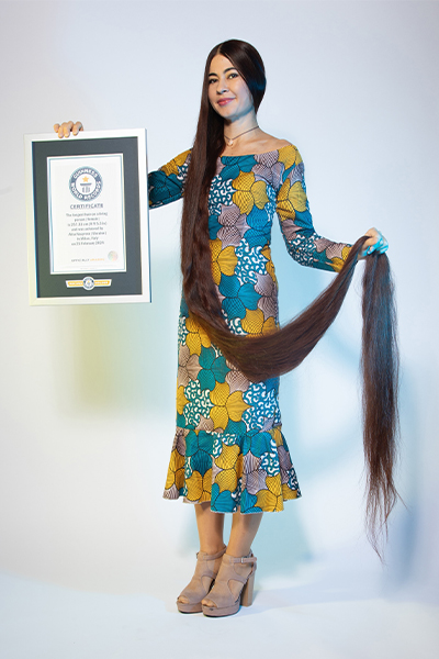 Real-life Rapunzel claims longest hair record with stunning 8-ft locks ...