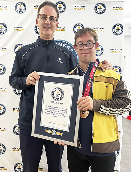 Chris Nikic becomes first person with Down's syndrome EVER to run all ...