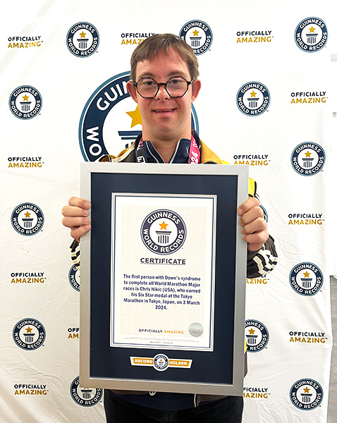 Chris Nikic becomes first person with Down's syndrome EVER to run all ...