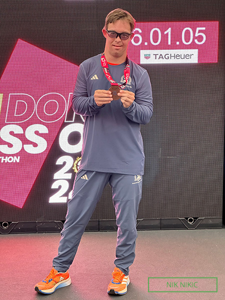 Chris Nikic becomes first person with Down's syndrome EVER to run all ...