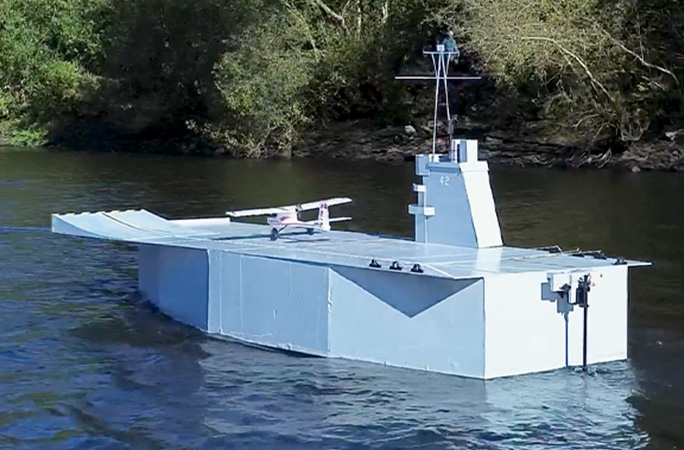 YouTuber lands plane on world’s largest RC aircraft carrier to set ...