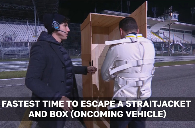 Escapologist flees locked box second before car smashes through it in ...