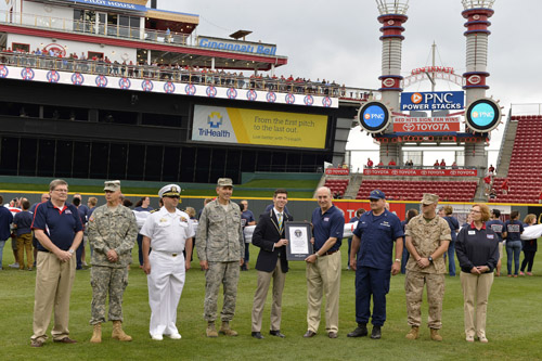USO collects most signatures on a flag to honor troops and military ...