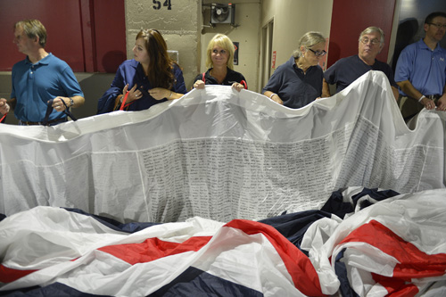 USO collects most signatures on a flag to honor troops and military ...