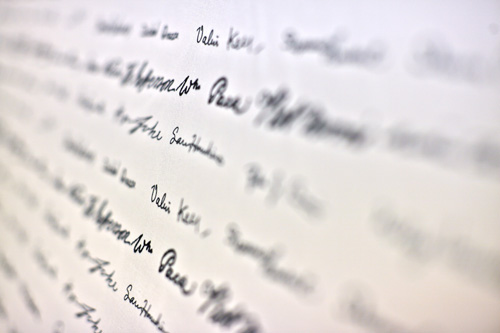 USO collects most signatures on a flag to honor troops and military ...