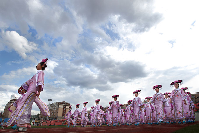 In pictures: 5,599 ladies wear cheongsam for stunning record attempt in ...