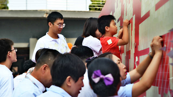 Community comes together to create a sentence using 6,800 stickers ...