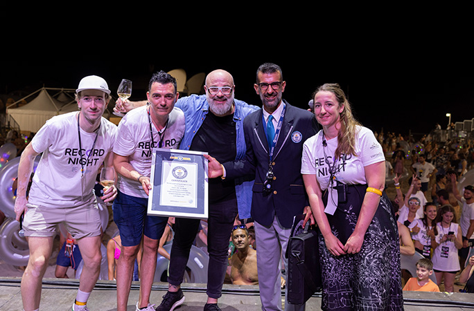 Thousands light up sandy Italian beach to break world record | Guinness ...