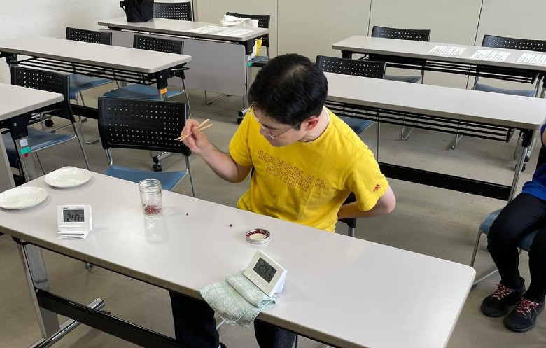 Most beans moved with chopsticks in one minute | Guinness World Records
