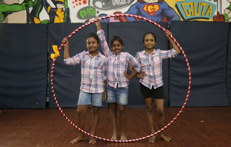 Most rotations of a hula hoop by a team of three in one minute ...