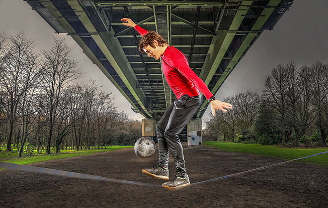 Longest duration controlling a football on an elevated slackline ...