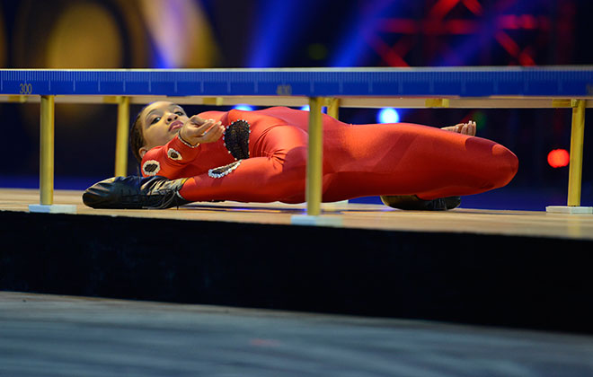 Farthest distance to limbo under 12 inch bars | Guinness World Records