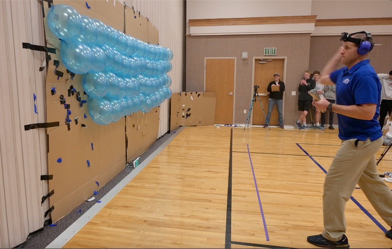 Most balloons burst with chopsticks in one minute | Guinness World Records