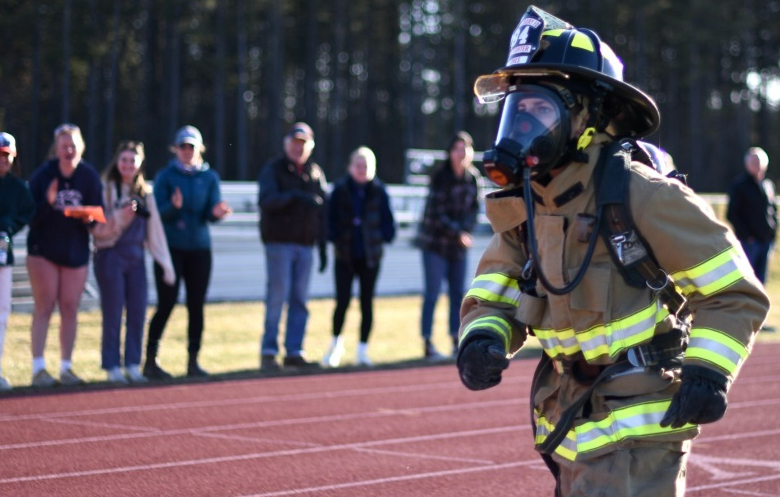 Fastest mile in a firefighter's uniform (female) | Guinness World Records