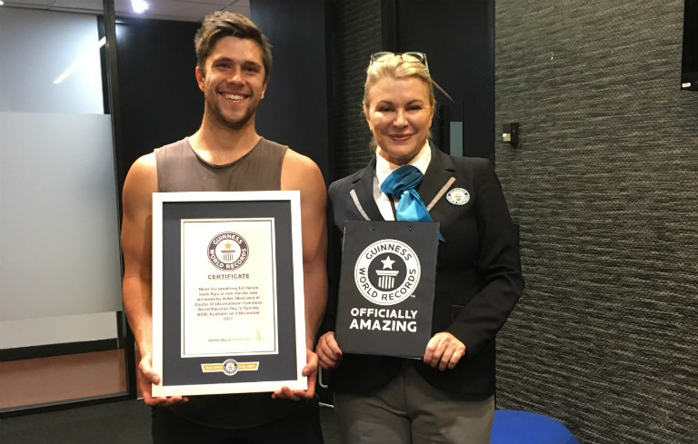 Most fire breathing full twist backflips in one minute | Guinness World ...