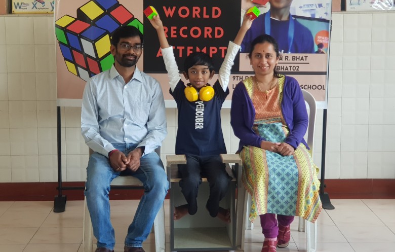 Fastest time to solve three rotating puzzle cubes simultaneously using ...