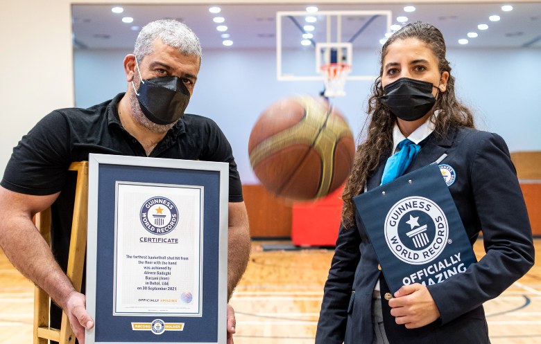 Farthest basketball shot hit from the floor with the hand | Guinness ...